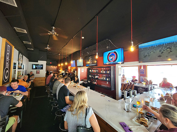 The bustling bar scene at Engine No. 9 is where burger dreams and cold beer meet—a match made in Florida foodie heaven.