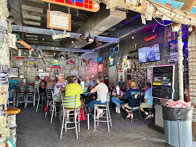Inside, dollar bills paper the walls like a financial wallpaper museum, creating the perfect backdrop for seafood that's worth every penny.