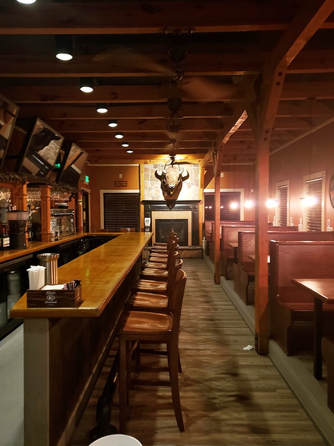 Step inside to discover a warm haven of wooden beams, cozy booths, and that buffalo head watching over the bar—the perfect backdrop for Maryland comfort food adventures.