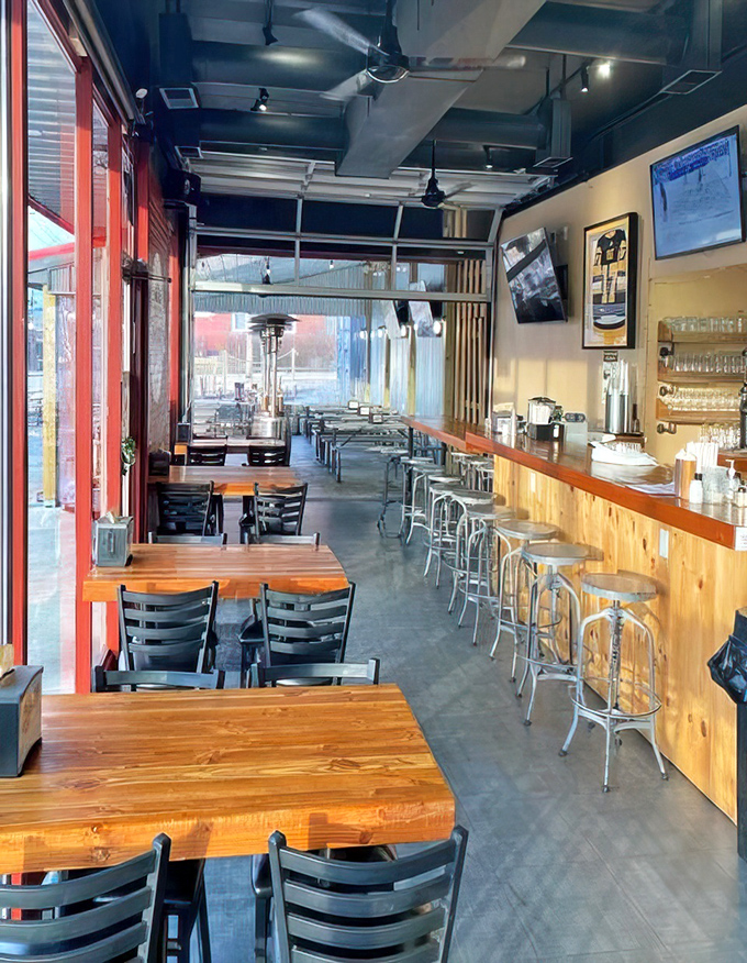 Industrial meets inviting in this thoughtfully designed space where wooden tables and metal chairs create the perfect backdrop for serious meat appreciation.