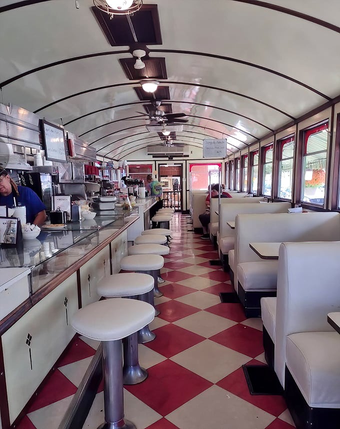 Step inside a time capsule where the curved ceiling, checkerboard floor, and counter stools haven't changed since your grandparents' first date—and neither has the quality.