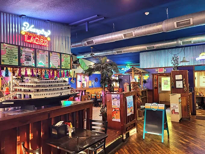 Step inside and you're transported to a nautical wonderland where corrugated metal, neon beer signs, and maritime decor create an atmosphere that's equal parts Midwest and coastal getaway.