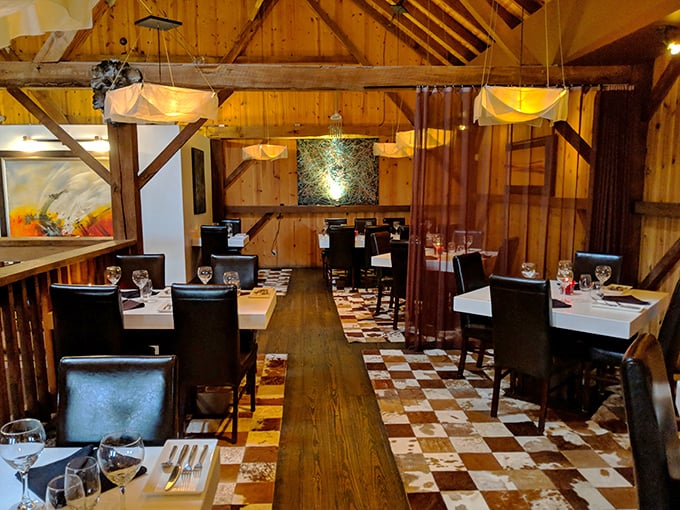 Exposed beams and checkerboard floors create dining drama. This isn't just a restaurant—it's dinner theater where the food steals the show.