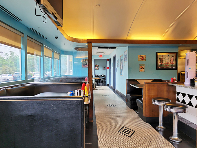 Step inside and the nostalgia hits you immediately—chrome stools, blue walls, and that unmistakable diner energy that says "breakfast is serious business here."