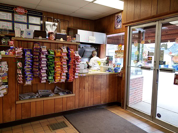 Step inside and time stands still – wood paneling, snack racks, and a no-nonsense counter where sandwich magic happens daily without the distraction of modern frills.