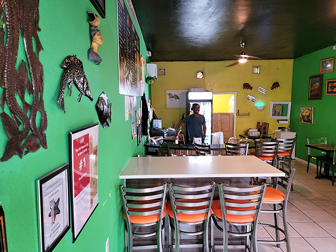 Inside, the vibrant green and yellow walls aren't just a nod to Jamaica's flag—they're a promise that what you're about to eat will be anything but bland.