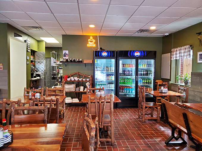 Rustic wooden tables, brick floors, and that glowing coffee sign—the universal symbol for "salvation is coming" on early Pittsburgh mornings.