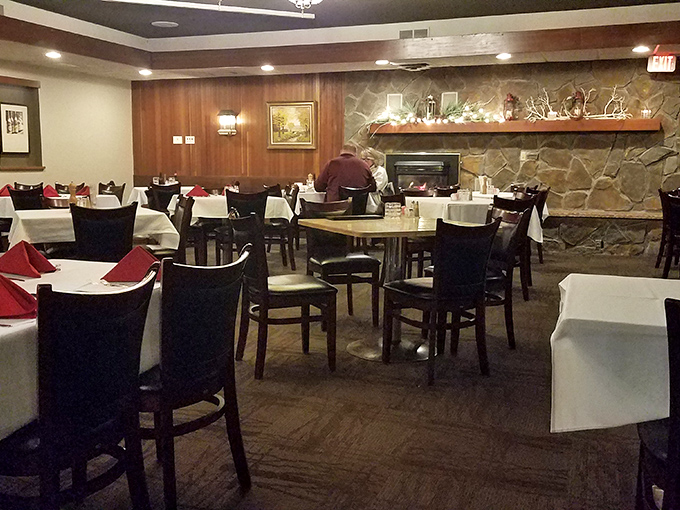 Wood paneling and white tablecloths create that perfect time-warp feeling. This isn't trendy dining—it's timeless dining, where conversations matter more than Instagram posts.