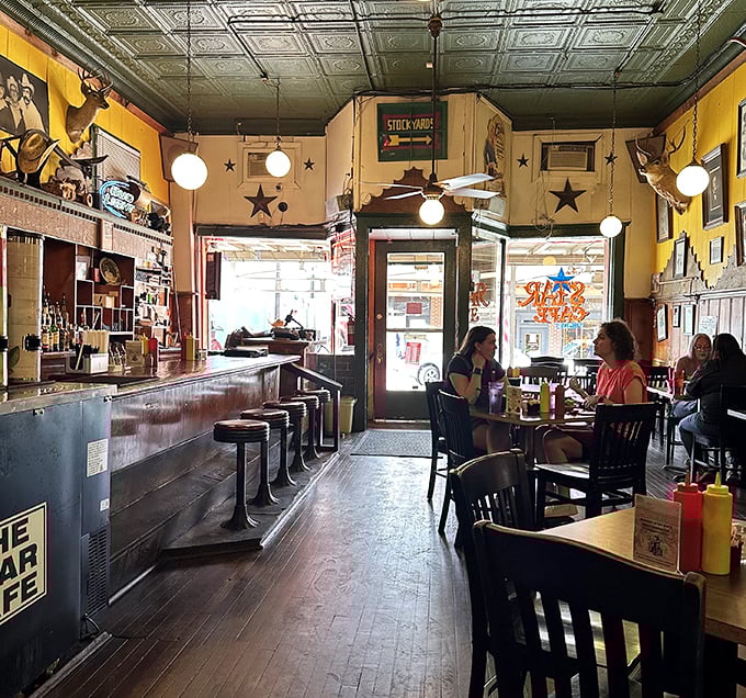 Step inside and time stands still – yellow walls, Texas stars, and a counter that's witnessed more local gossip than a small-town barber shop.