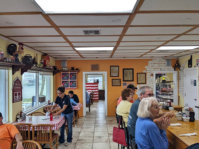 Where magic happens! Orange walls and farm decor create the perfect backdrop for morning conversations and coffee refills that never seem to end.