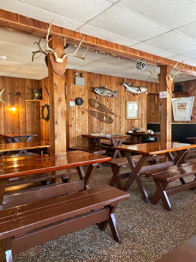Wooden picnic tables, mounted fish, and antlers create the quintessential Old Florida atmosphere. Rustic charm that whispers, "The food matters more than the furniture."