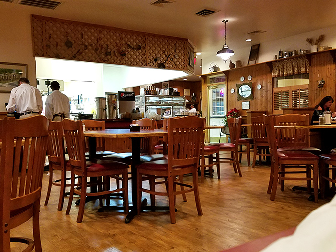 Wood-paneled warmth and honest furniture create the perfect backdrop for serious comfort food conversations and memorable meals.