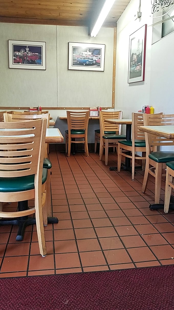 Simple wooden tables, classic car photos, and that unmistakable diner charm—Mike's interior feels like stepping into a comfort food time machine.