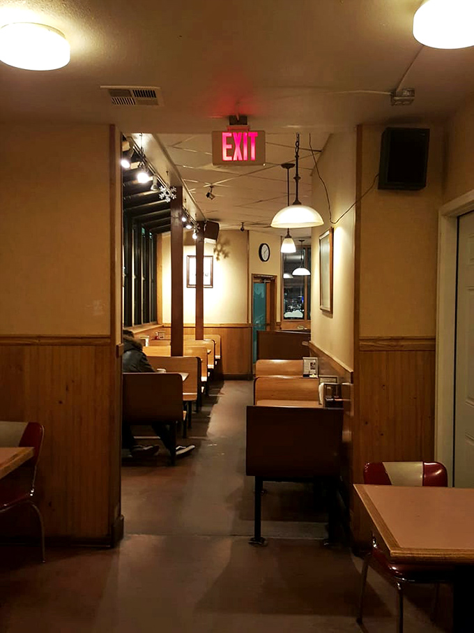 Classic diner booths where conversations flow as smoothly as the coffee refills keep coming.