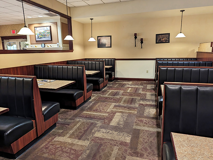 Cozy booths await hungry travelers. This isn't fancy dining—it's the comfortable embrace of a place that understands what matters: good food and plenty of it.