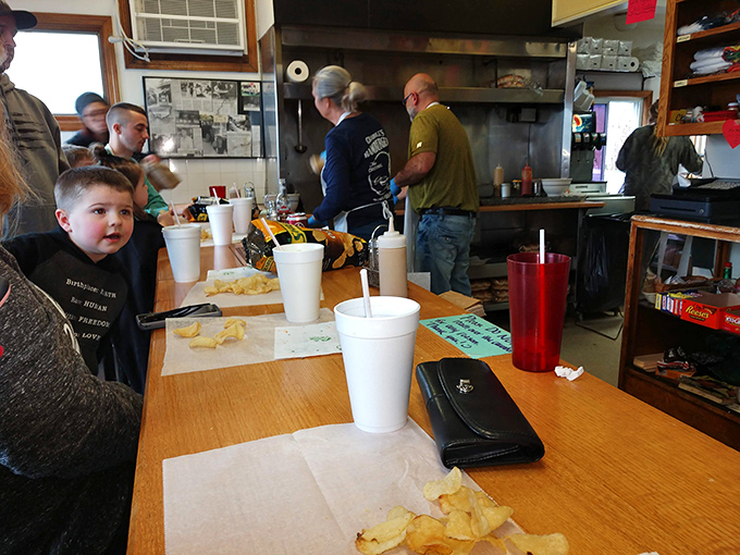 Inside Crabill's, every square inch matters. The compact counter space puts you front-row for the burger-making spectacle while hungry patrons wait their turn.