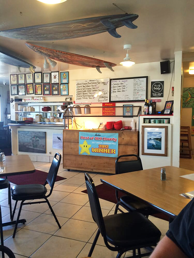 Surfboards hang from the ceiling like guardians of flavor, watching over diners about to embark on a taste adventure.