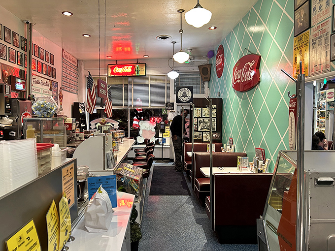 Aqua diamond walls meet vintage Coca-Cola signs. Step inside and suddenly your smartphone feels oddly out of place in this perfectly preserved slice of Americana.