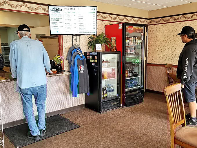 Inside, no-nonsense decor tells you everything you need to know: this place focuses on the food, not fancy frills. The wallpaper border? Pure Michigan nostalgia.