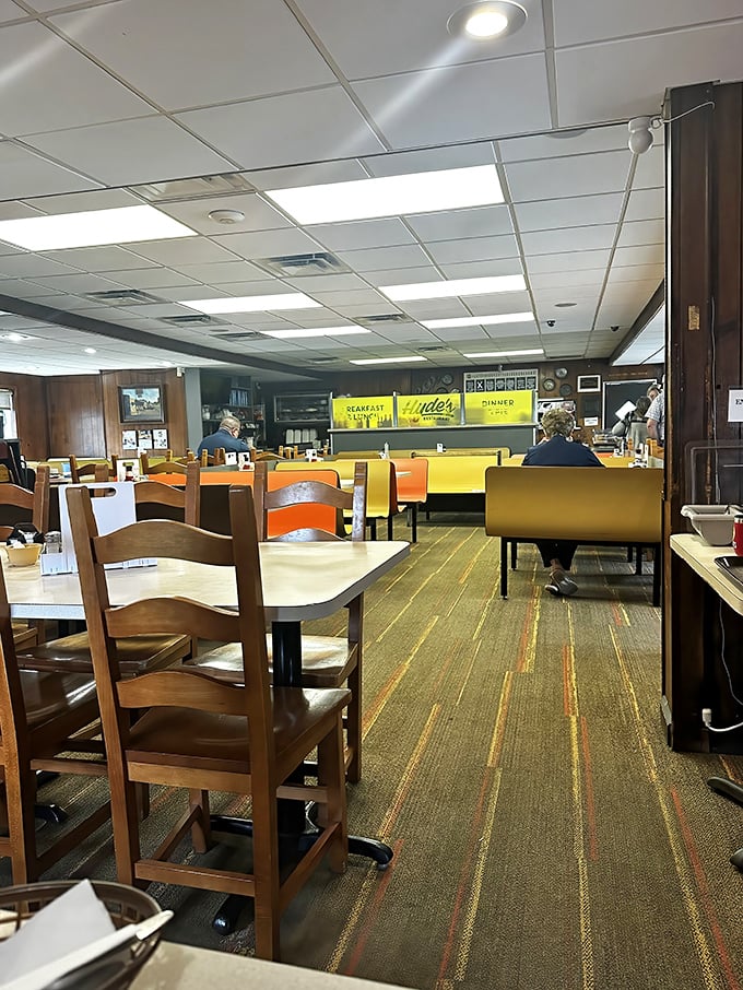 Step inside and you're transported to a simpler time—yellow vinyl booths, wood paneling, and the promise of comfort food that actually delivers.