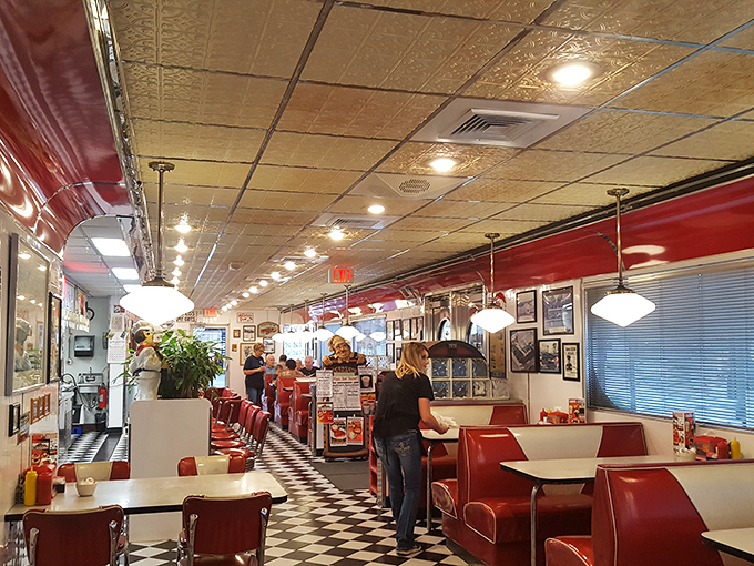 Classic red vinyl booths, checkered floors, and pressed tin ceilings—this isn't retro-inspired, folks. This is the real deal that Instagram filters try to replicate.