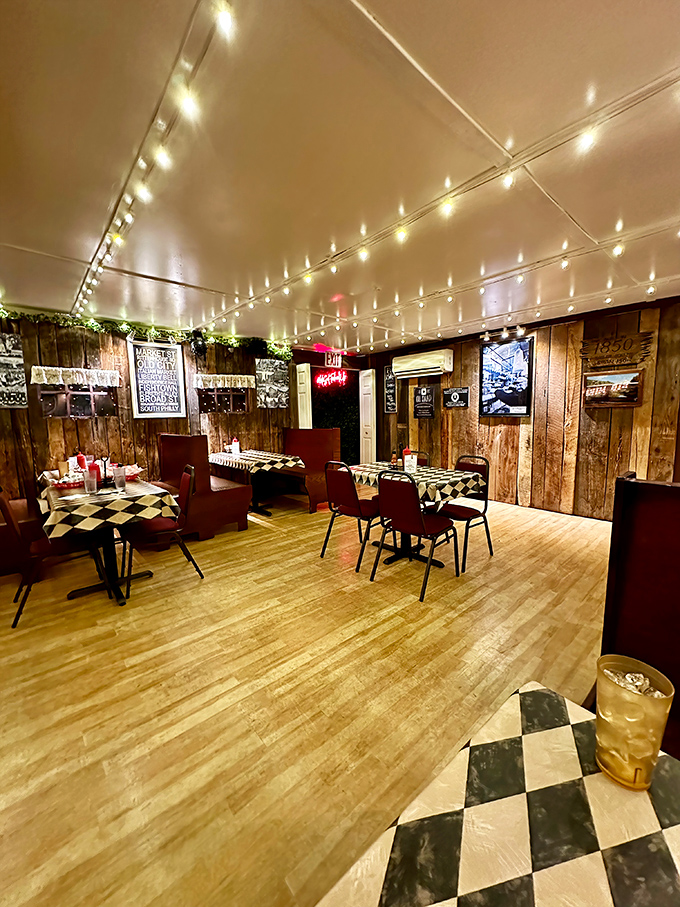 Wooden walls, checkered tablecloths, and string lights create the perfect rustic-meets-urban vibe—like your favorite neighborhood joint got lost in the mountains and decided to stay. 