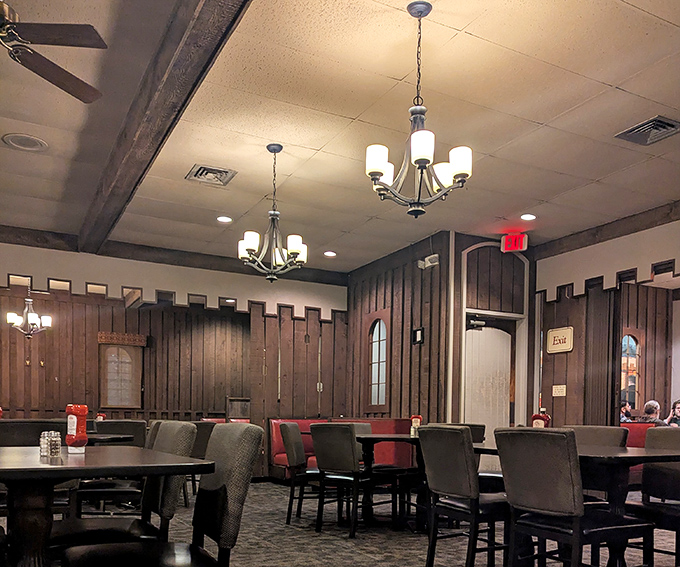 Step inside and you're transported to the 1970s—dark wood paneling, castle-inspired details, and chandeliers that say "we're fancy, but not too fancy."