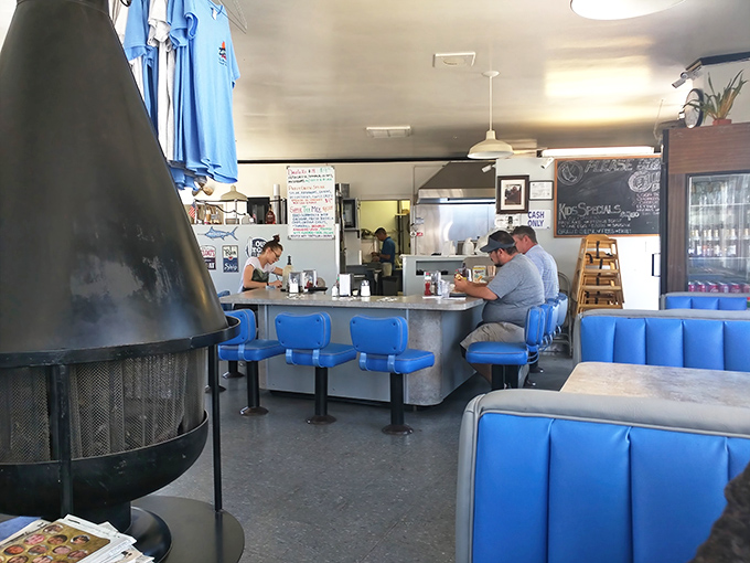 The iconic blue booths and counter stools aren't trying to be retro—they're the real deal, seasoned by decades of breakfast conversations and coffee refills.