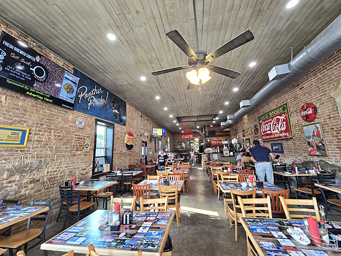 Exposed brick walls, wooden ceiling planks, and vintage Coca-Cola signs – this isn't retro by design, it's authentic by survival.