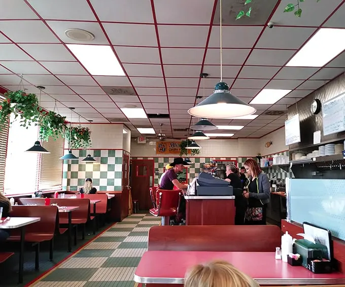 Classic checkerboard floors and red vinyl booths create the perfect backdrop for breakfast magic. This isn't retro-themed—it's authentically unchanged because it never needed improving.