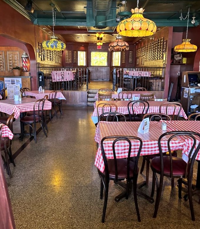 Red-checkered tablecloths and vintage lighting create the perfect backdrop for culinary memories. This isn't just dining—it's time travel with taste buds.