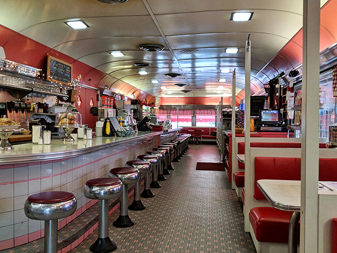 Step inside and time travel to the 1950s—this classic diner interior with its curved ceiling and counter stools promises nostalgia served alongside your meal. 
