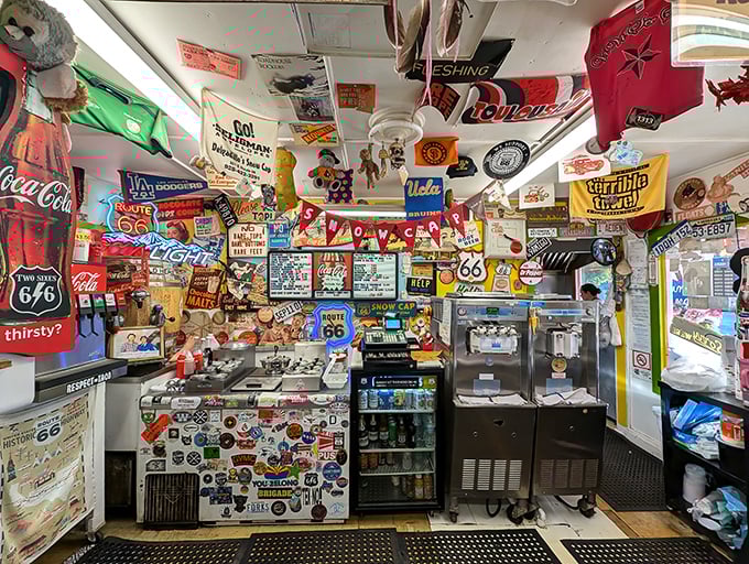 Inside, every inch tells a story. This isn't decoration—it's a half-century archive of American road trip memories plastered gloriously on display.