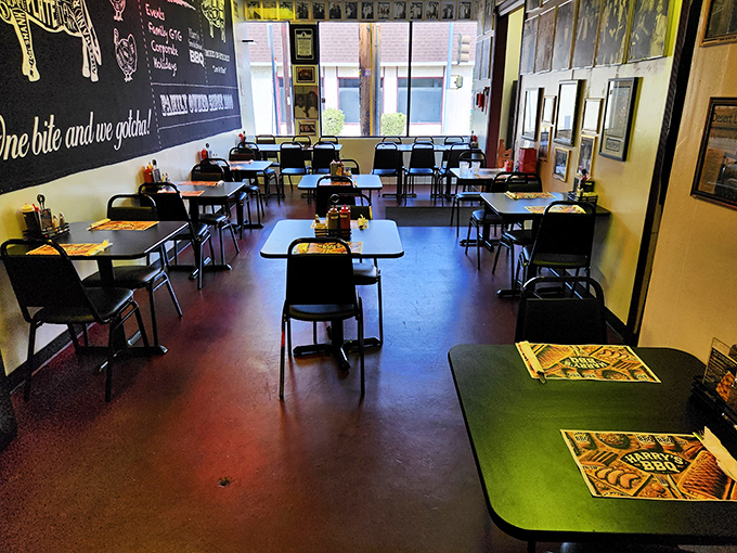 Simple tables, no-nonsense chairs, and that chalkboard wall promising delicious things to come. This is BBQ as it should be.