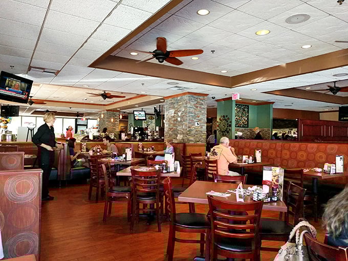 Inside, warm wood tones and comfortable seating create that perfect diner atmosphere—where breakfast decisions become life's most important choices.