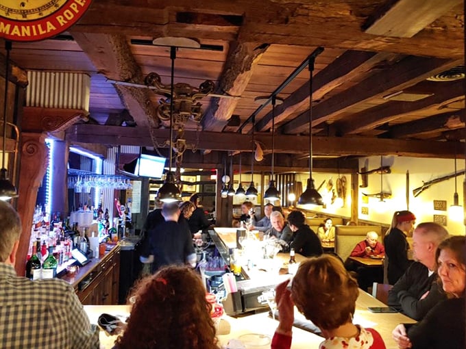 Rustic wooden beams frame the bustling bar area where locals and travelers alike gather. This isn't manufactured charm—it's the real deal, aged to perfection like a fine bourbon.