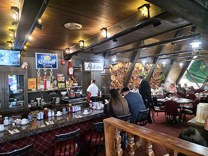 Rustic cabin vibes meet diner comfort in Country Way's wood-paneled interior. The log wall feature isn't just for show—it's storing enough breakfast energy to power a lumberjack convention.