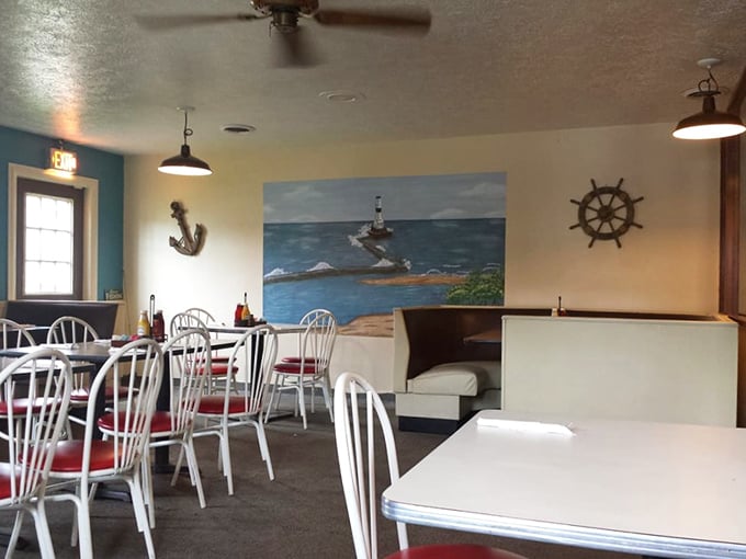 Nautical charm meets small-town comfort. That lighthouse mural isn't just decoration—it's foreshadowing the beacon of flavor this place has become.