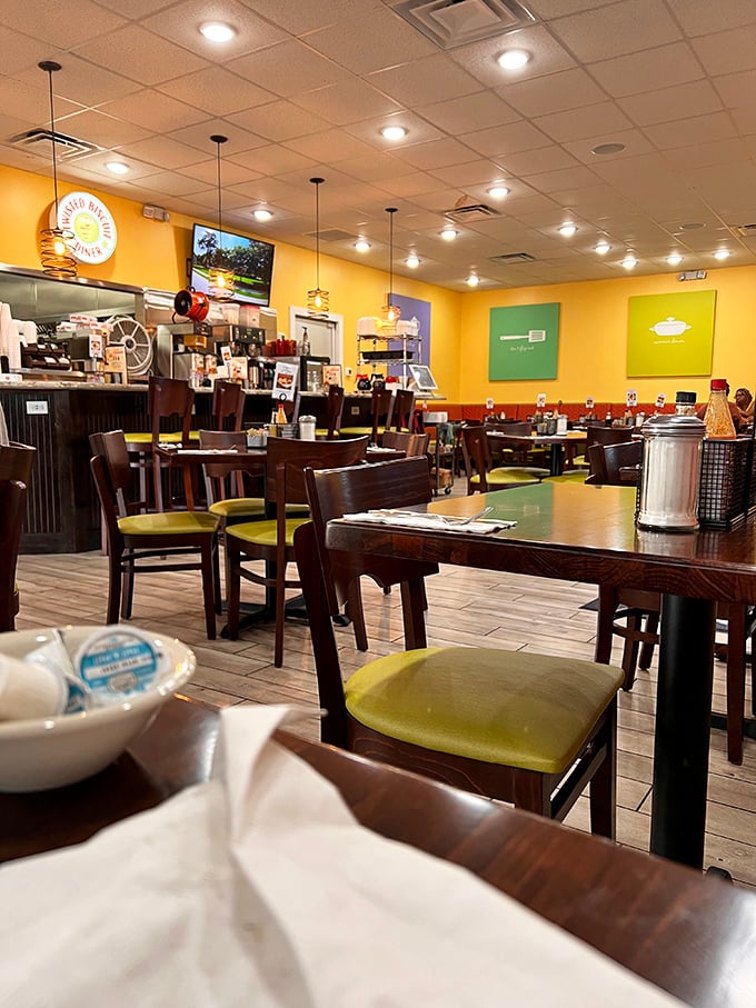 Cheerful yellow walls and wooden tables create the perfect backdrop for biscuit-induced euphoria. This isn't just a diner; it's a morning happiness factory.