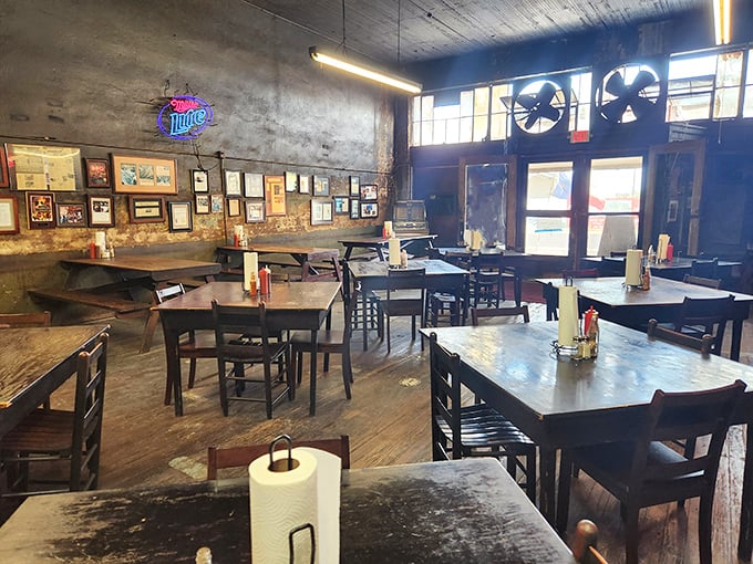 Decades of smoke have seasoned these walls like nature's wallpaper. Each stain tells a story of brisket past.