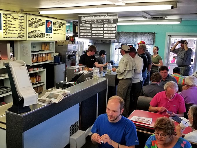 Inside, the bustling counter scene feels like a community reunion. Locals and travelers alike queue up for what might be Central Oregon's most honest-to-goodness burger experience.