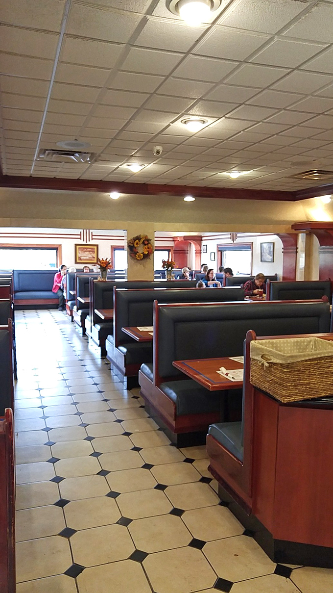 Classic booth seating and checkered floors create the perfect backdrop for memorable meals and conversations.