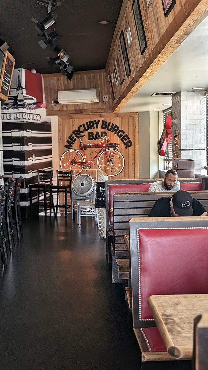Wooden paneling, red vinyl booths, and a vintage bicycle on the wall—Mercury's interior feels like a warm hug from your favorite uncle.