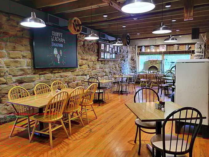 Rustic stone walls and wooden beams create the perfect backdrop for ice cream indulgence—like eating dessert inside a Norman Rockwell painting.