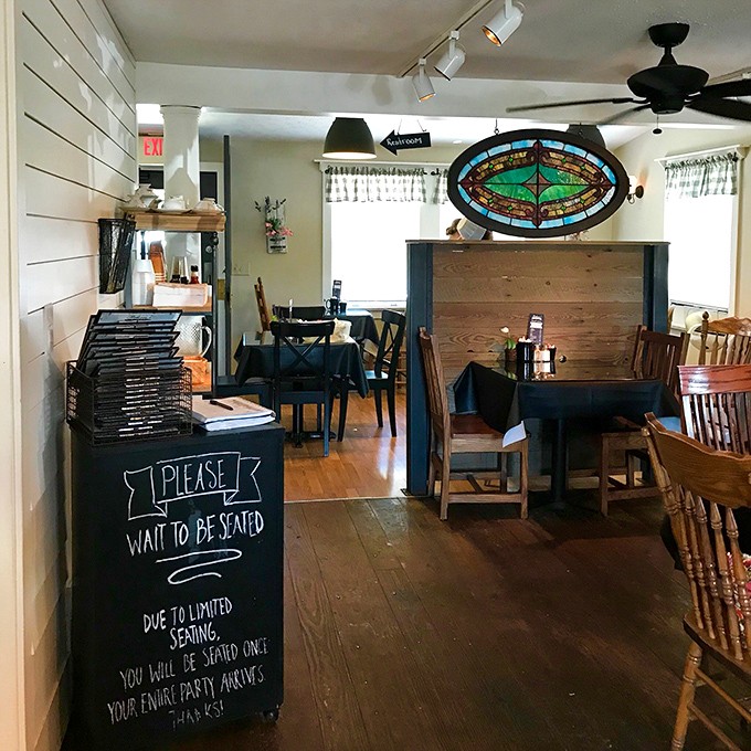 Step inside and the bistro's charm reveals itself immediately – wooden floors, stained glass, and a handwritten welcome that feels like coming home.