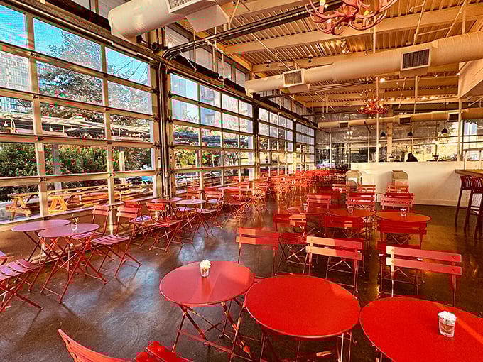 Those vibrant red bistro chairs aren't just Instagram bait—they're front-row seats to the greatest pastry show in Southern California.