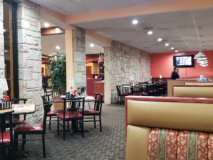 Inside, the warm color scheme and comfortable seating create that perfect diner atmosphere where conversations flow as freely as the coffee.