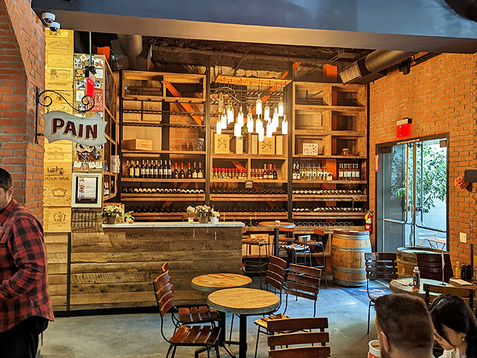 Exposed brick, wooden accents, and wine bottles galore—this isn't just a bakery, it's a French escape where time slows down deliciously.