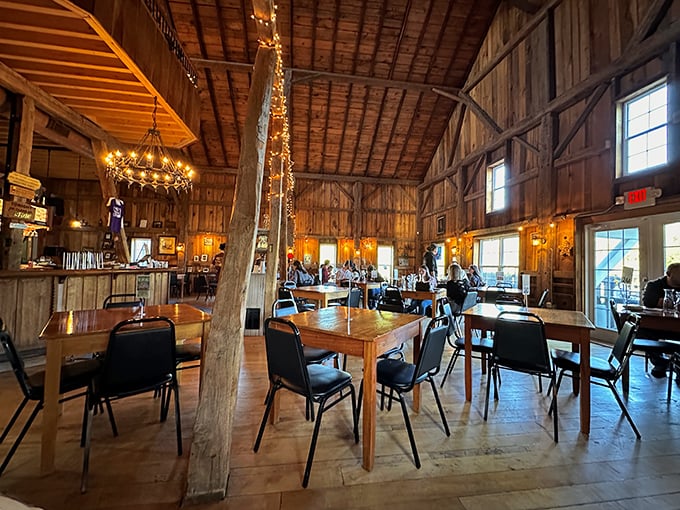 Inside, wooden beams and twinkling lights create the perfect atmosphere for wine tasting—like stepping into a Pinterest board that serves alcohol.