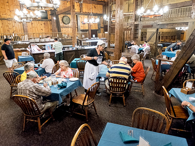 Dining beneath century-old beams while servers in traditional dress deliver comfort food feels like time travel with the bonus of indoor plumbing. 